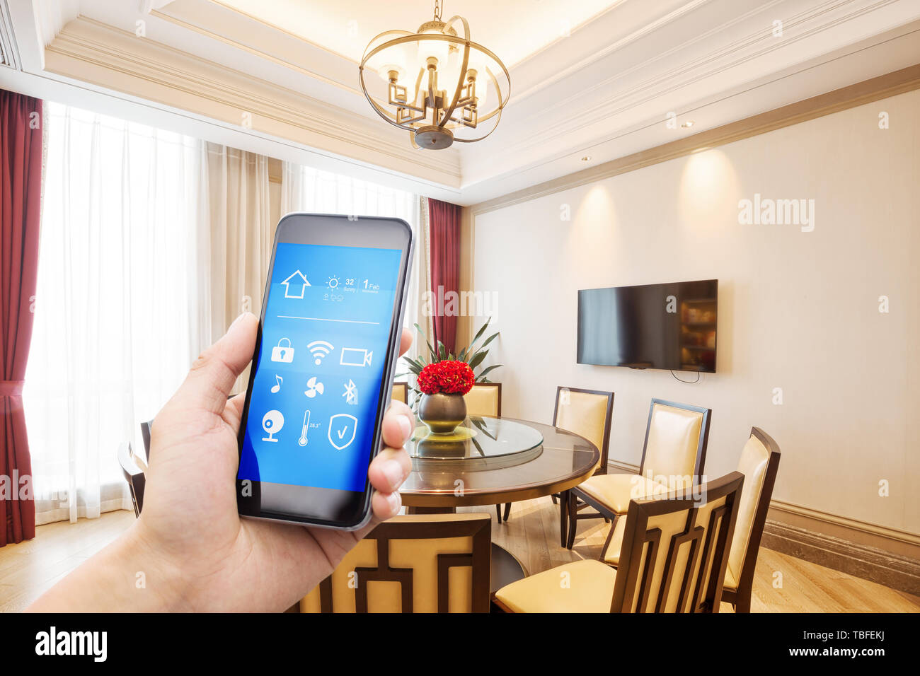 Mobile phone in smart home Stock Photo - Alamy