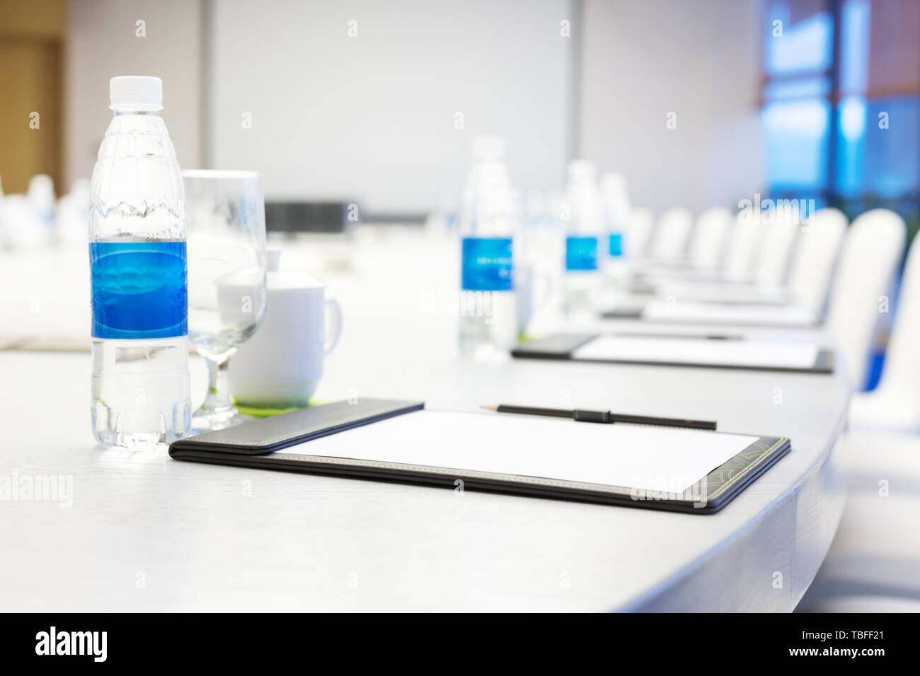 white big table in modern meeting room Stock Photo - Alamy