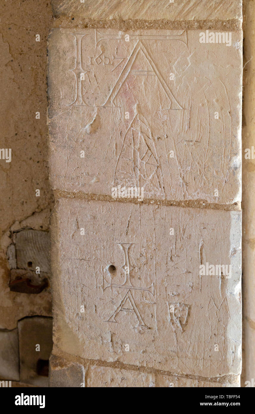 Initials names graffiti carved into stone of doorway at Church of St ...
