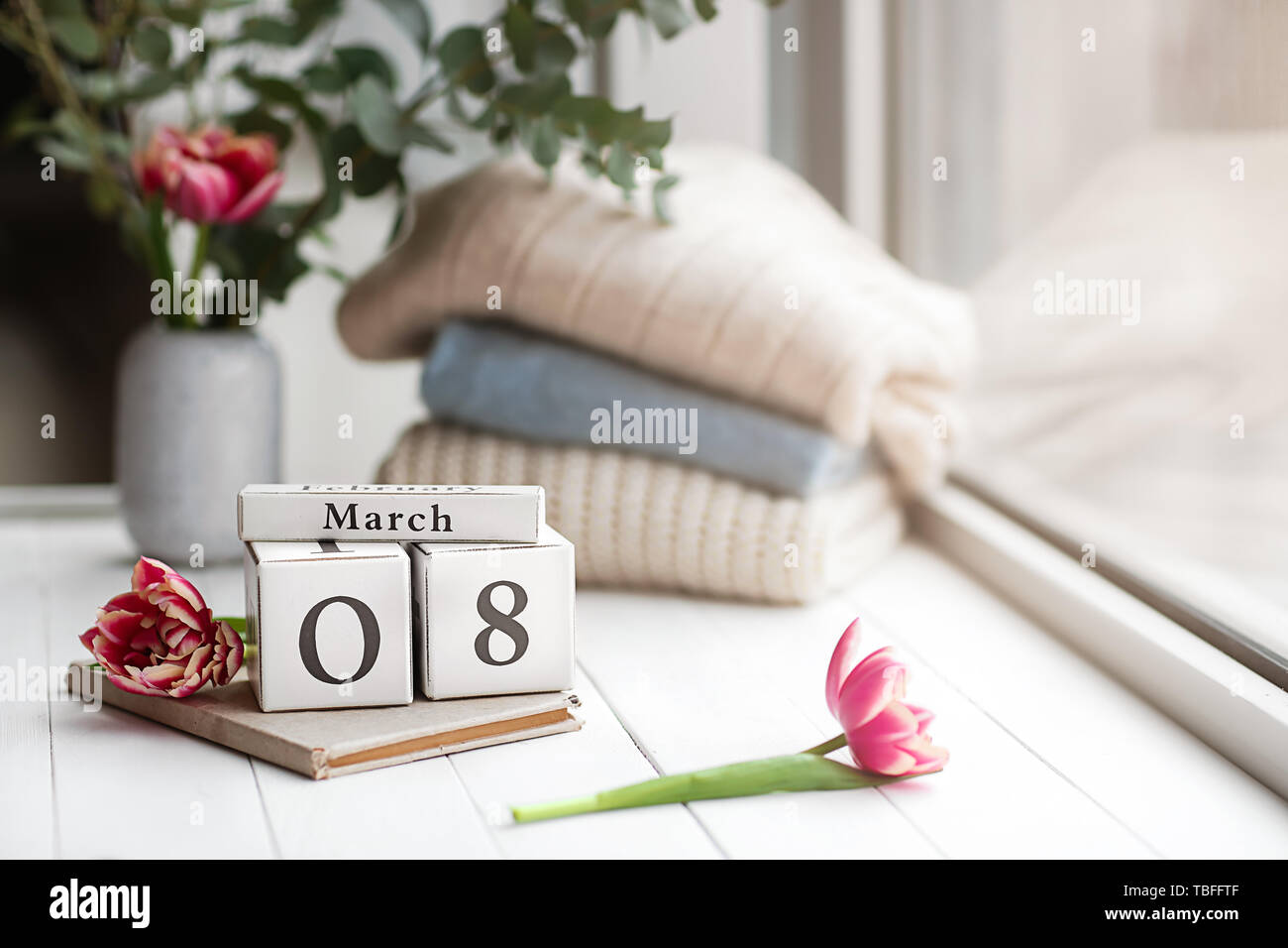 Calendar with date of March 8 on window sill Stock Photo - Alamy