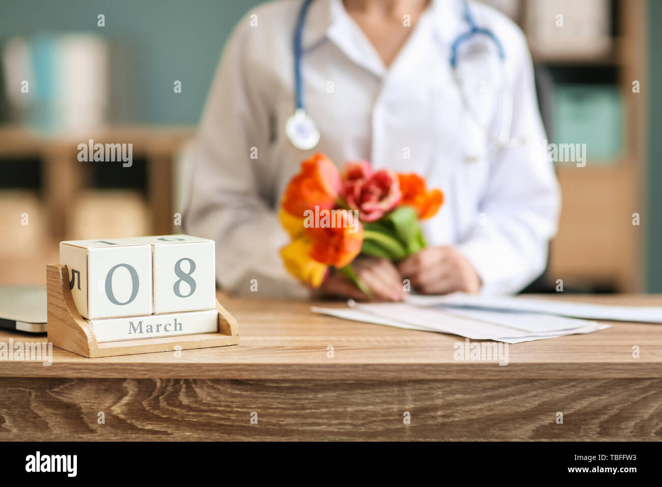 Calendar with date of March 8 on table of female doctor Stock Photo - Alamy