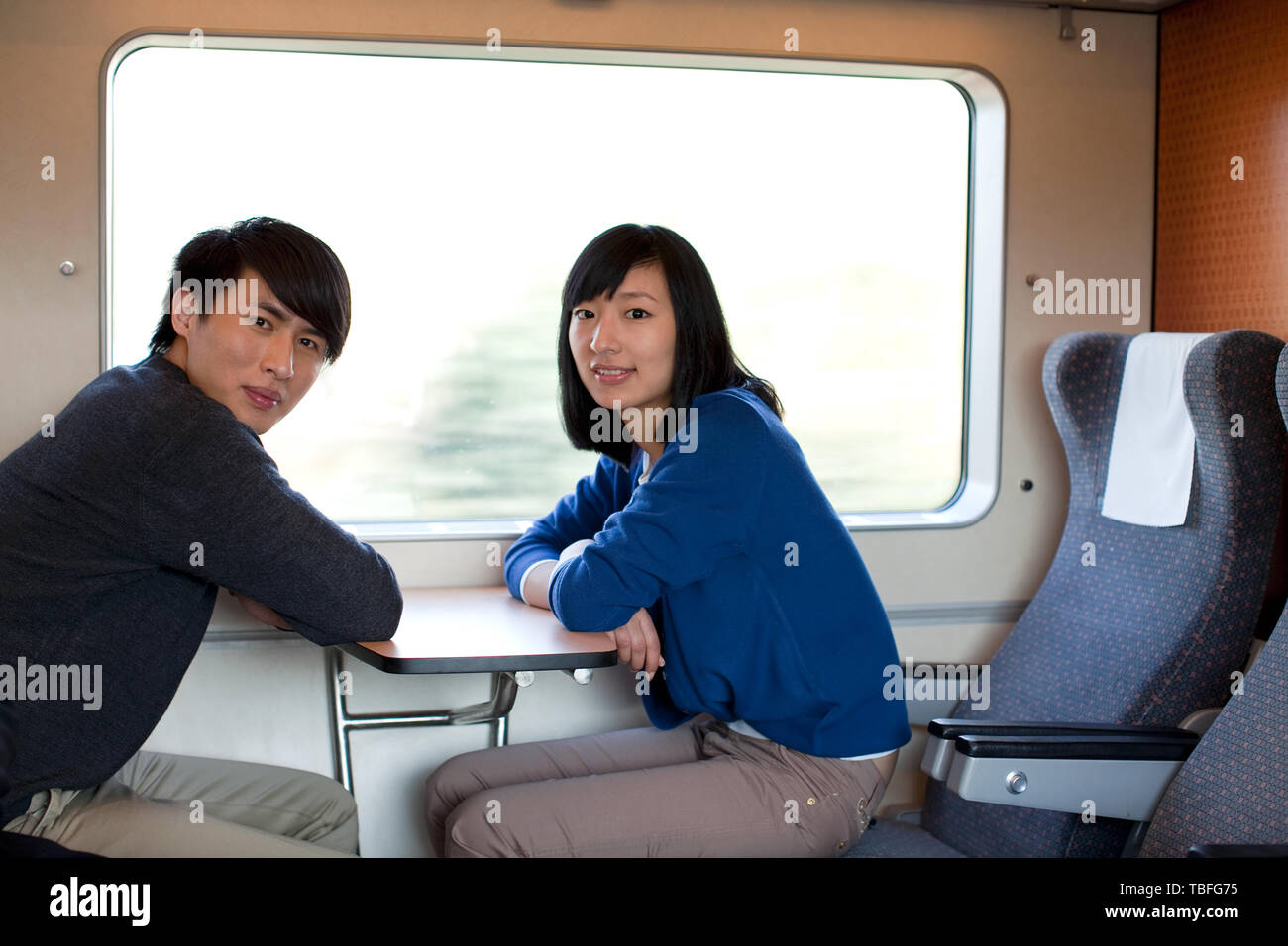 A couple on a train Stock Photo - Alamy