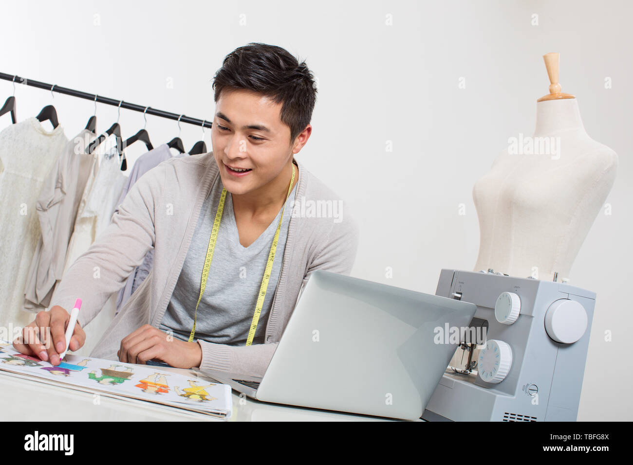 Costume designer designs costumes Stock Photo - Alamy