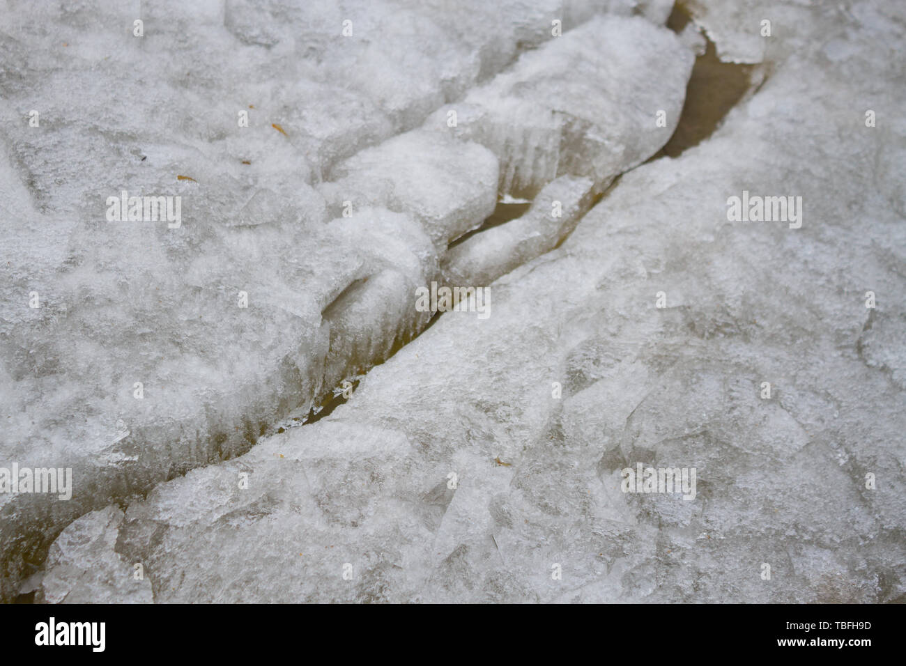 cracked ice on river in spring. danger concept Stock Photo - Alamy
