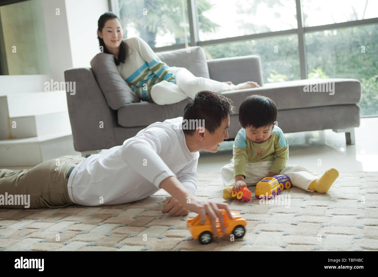 Parents and children play games Stock Photo - Alamy