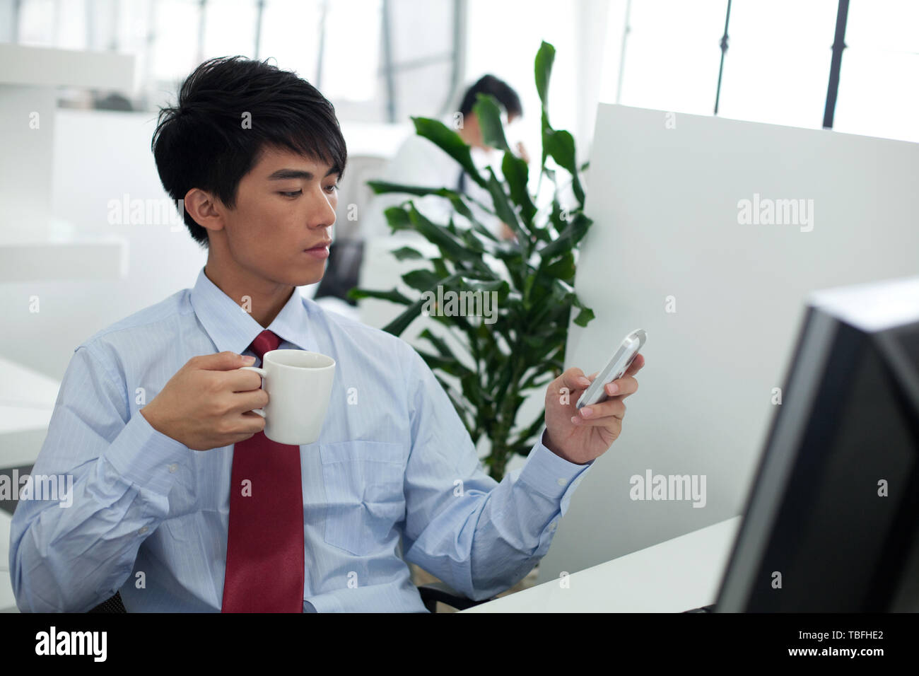 A white-collar man in front of a computer Stock Photo - Alamy