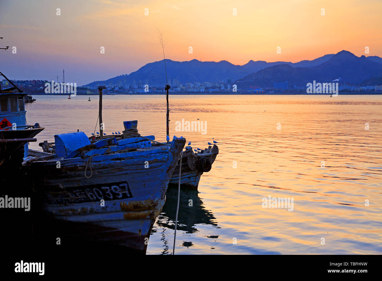 Photos of fishing boats in fishing port Stock Photo - Alamy