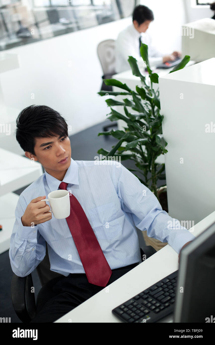 A white-collar man in front of a computer Stock Photo - Alamy
