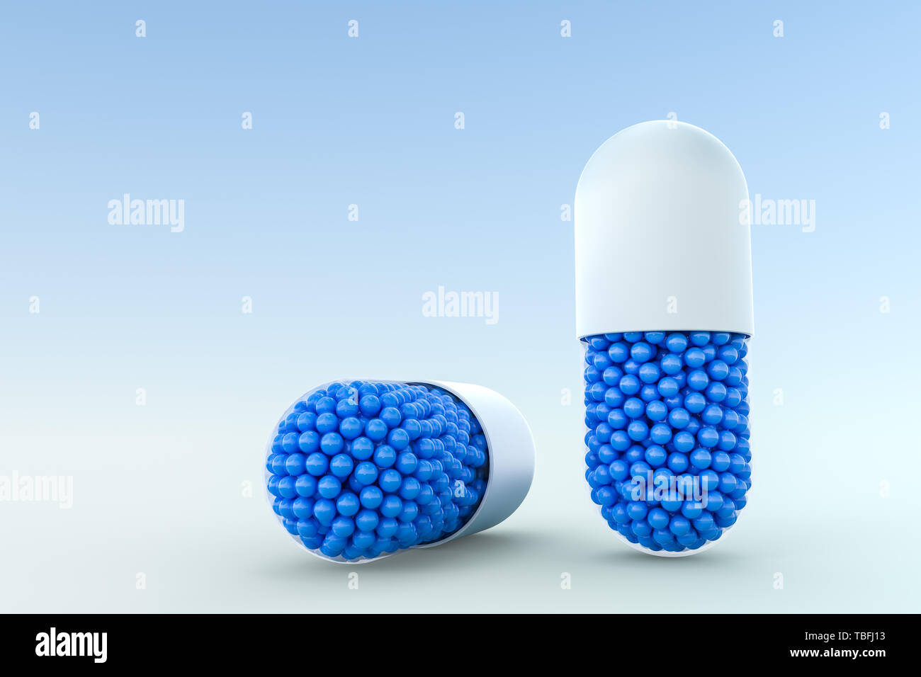 Blue granular capsule, 3-D rendering Stock Photo - Alamy