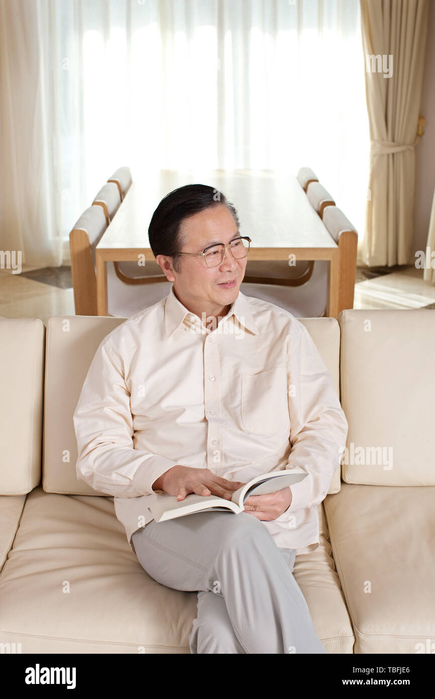 The elderly read books and enjoy their old age Stock Photo - Alamy