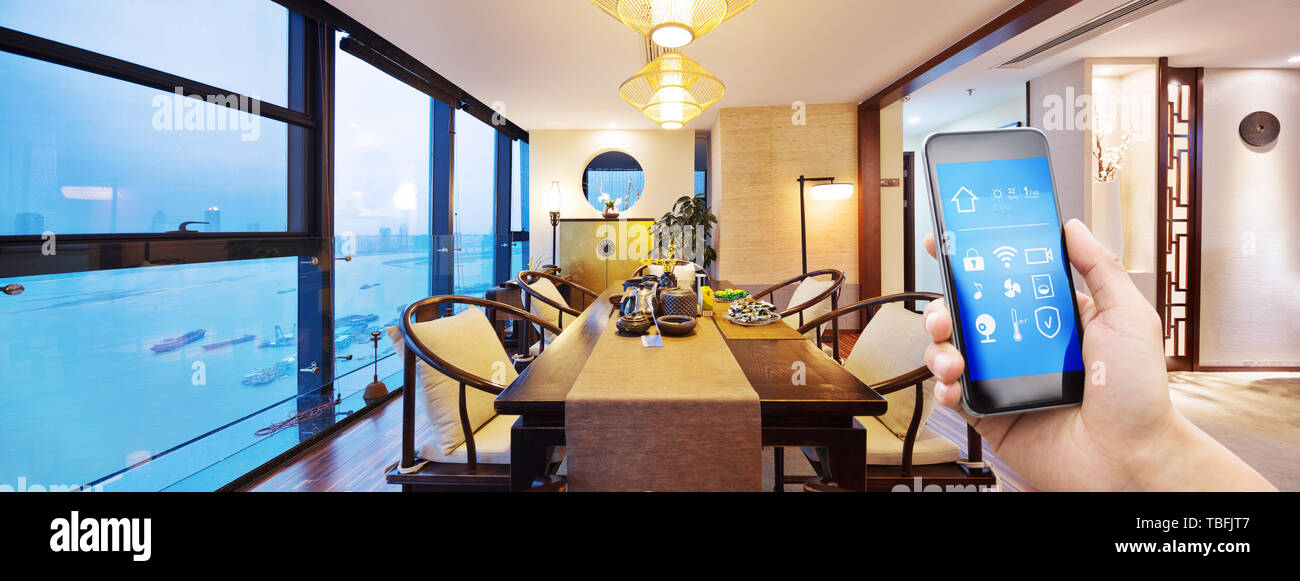 smart phone with smart home with modern dining room Stock Photo - Alamy