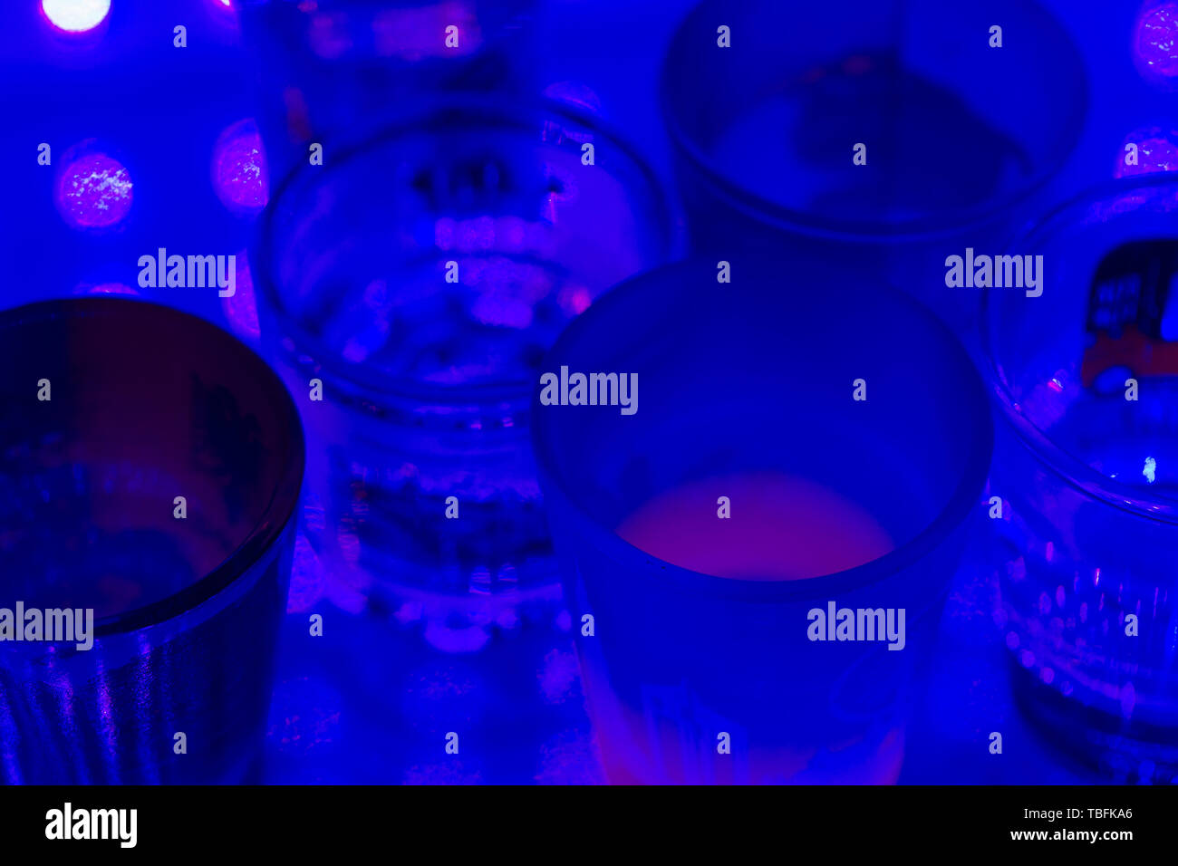 shots with alcohol in blue neon light Stock Photo - Alamy