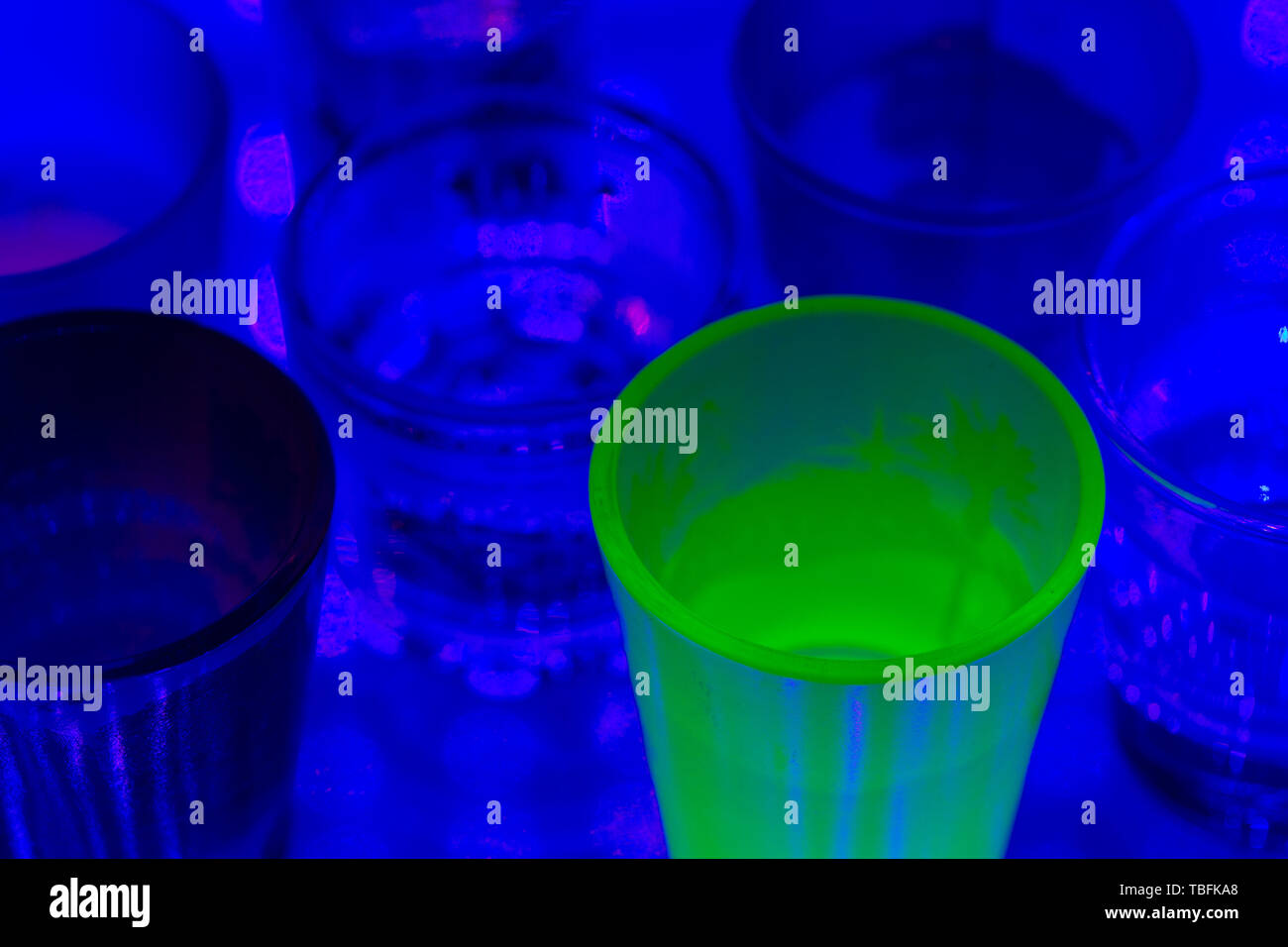 shots with alcohol in blue neon light Stock Photo - Alamy