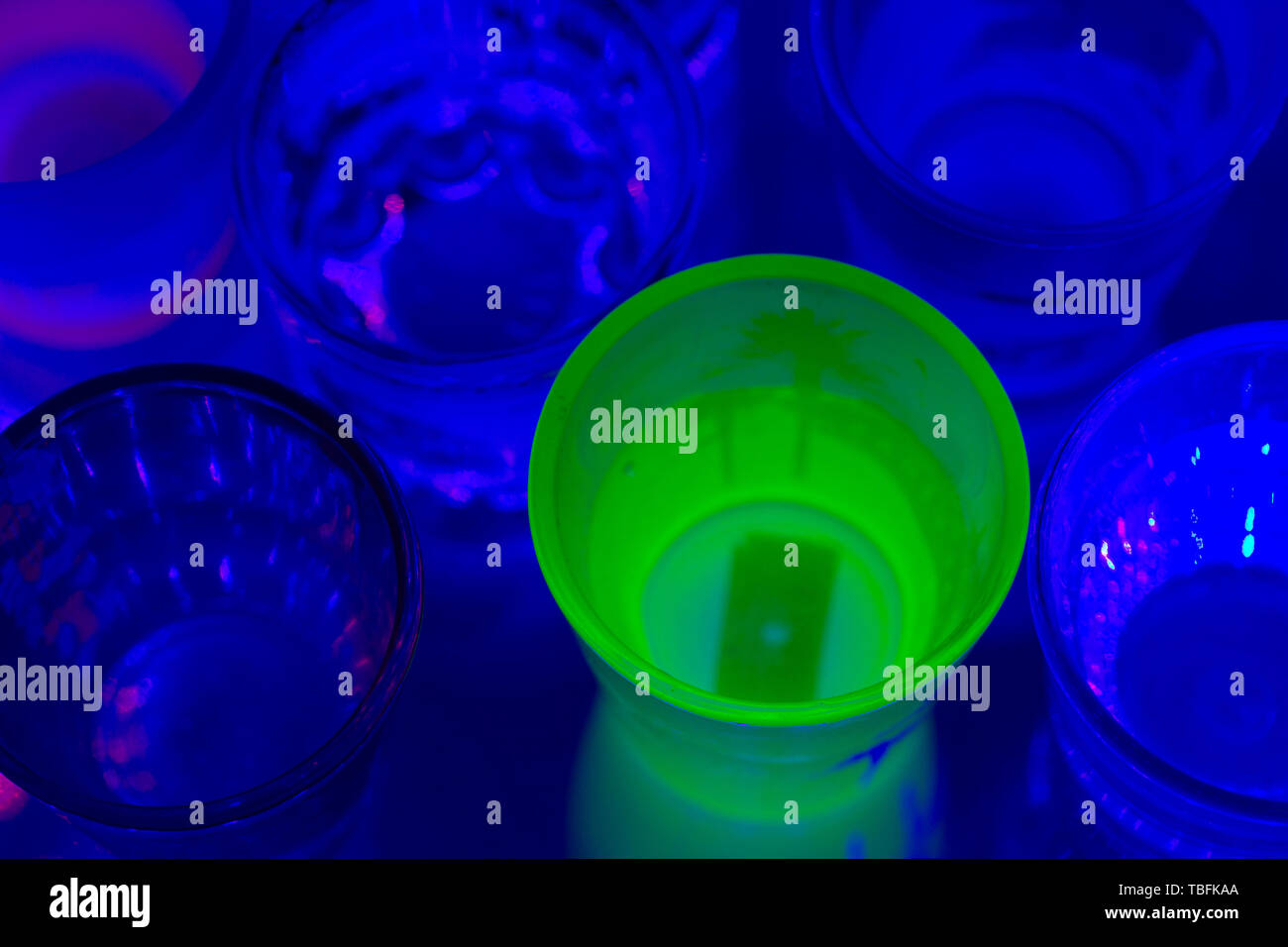 shots with alcohol in blue neon light Stock Photo - Alamy