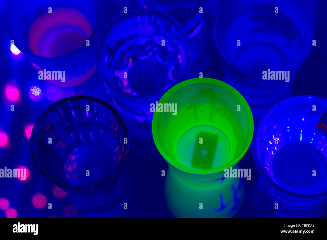 shots with alcohol in blue neon light Stock Photo - Alamy