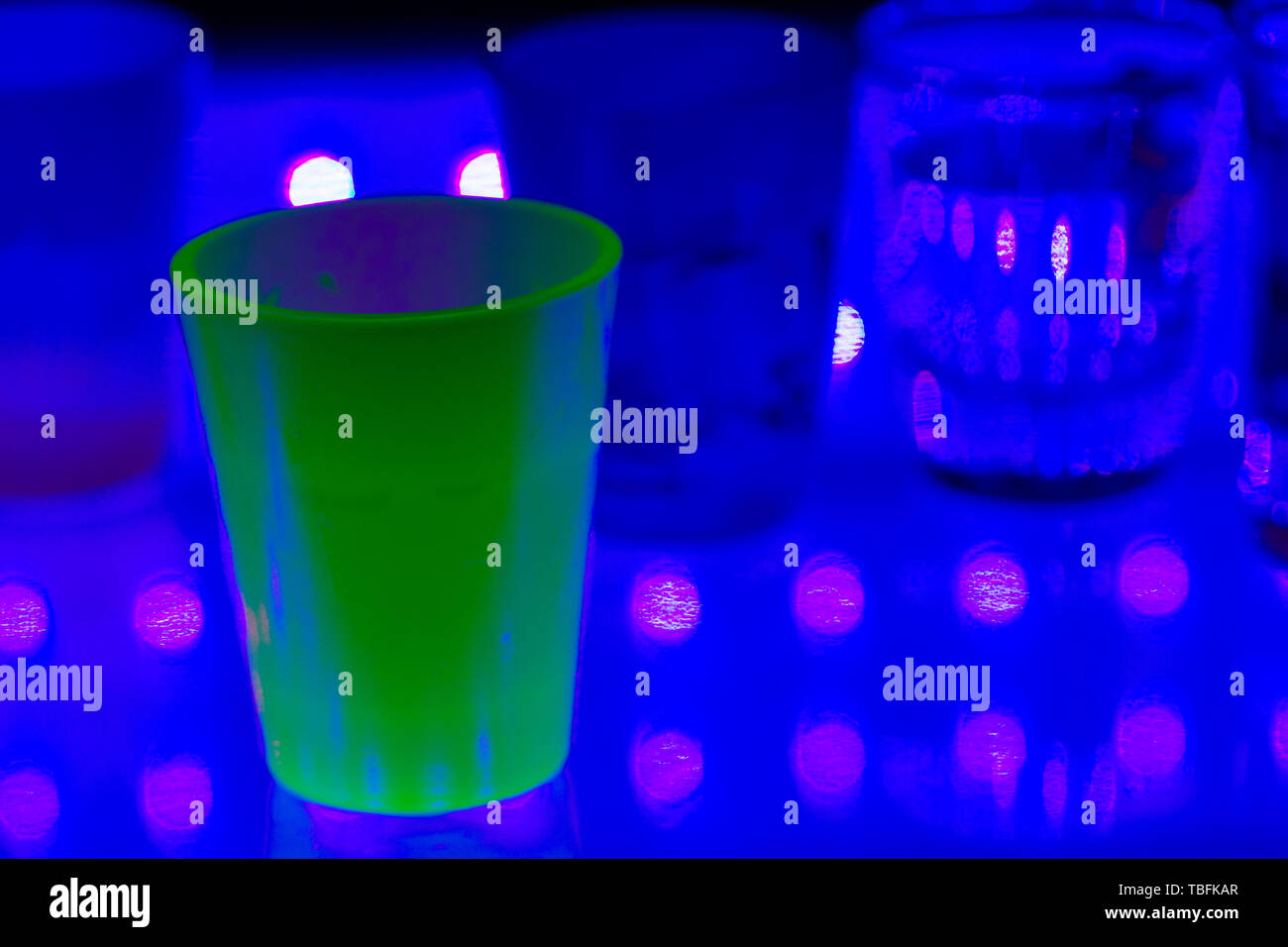 shots with alcohol in blue neon light Stock Photo - Alamy