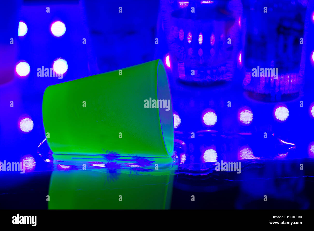 shots with alcohol in blue neon light Stock Photo - Alamy