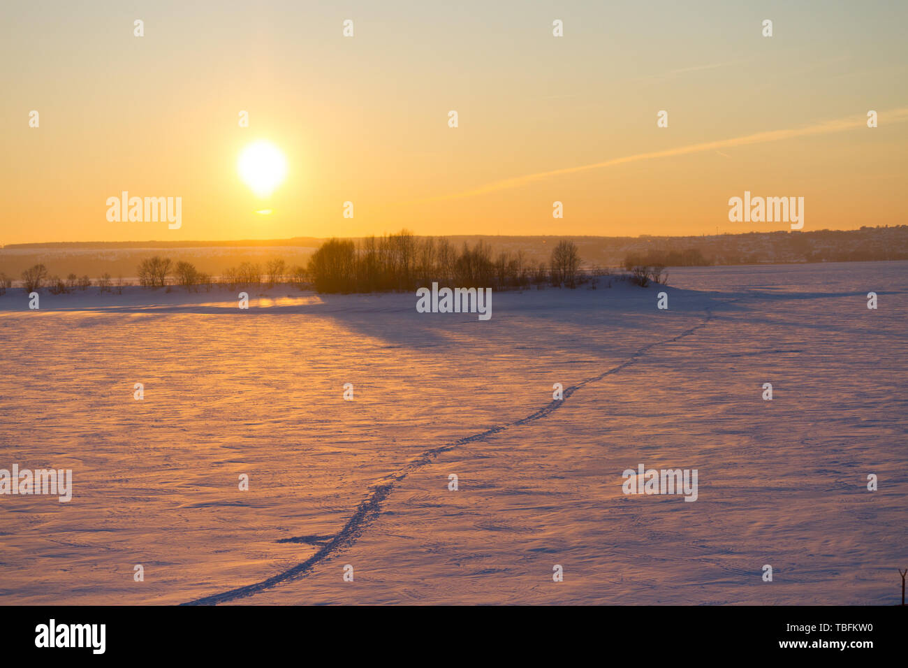 winter sunset over field. foot path Stock Photo - Alamy
