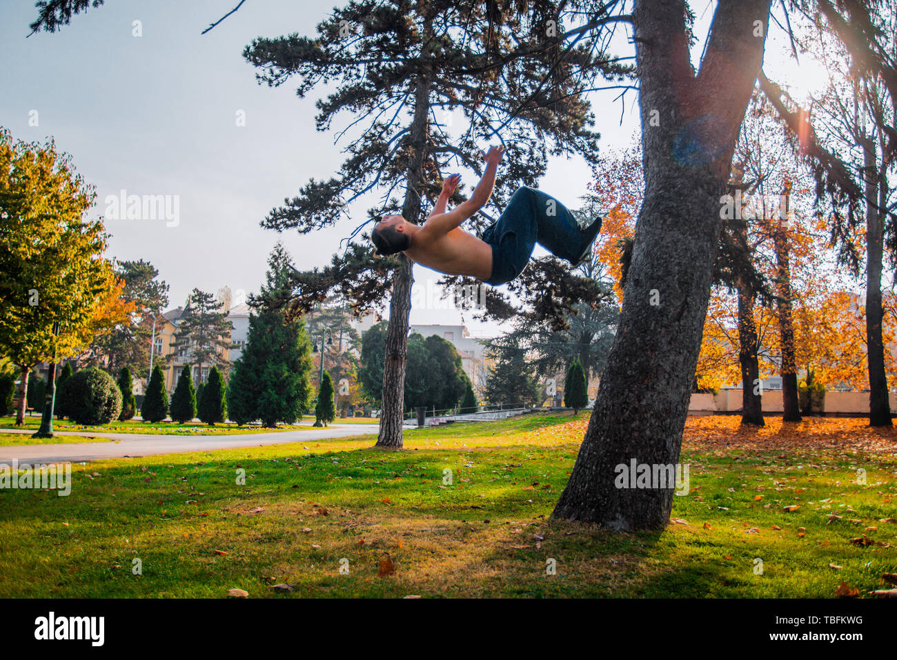 Free runner trains parkour while jumping in the air Stock Photo - Alamy