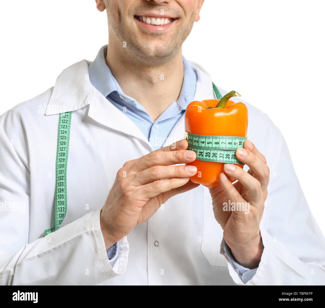 Male nutritionist on white background Stock Photo - Alamy