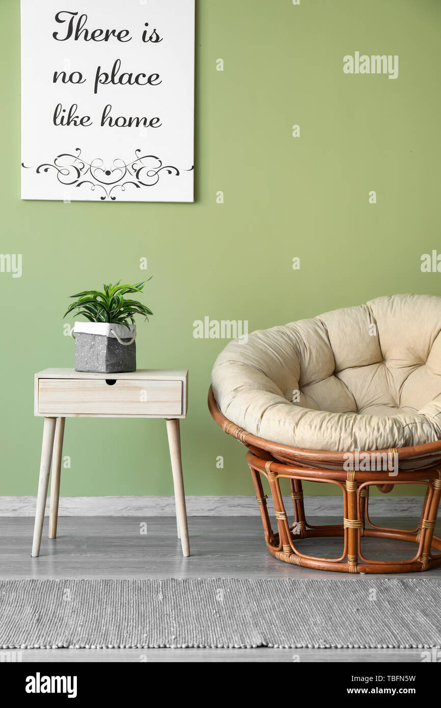 Interior of room with armchair and table Stock Photo - Alamy