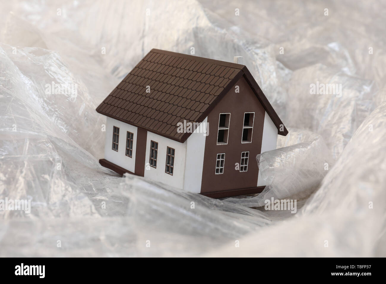 Model of house on polyethylene plastics. Concept of earthquake Stock ...