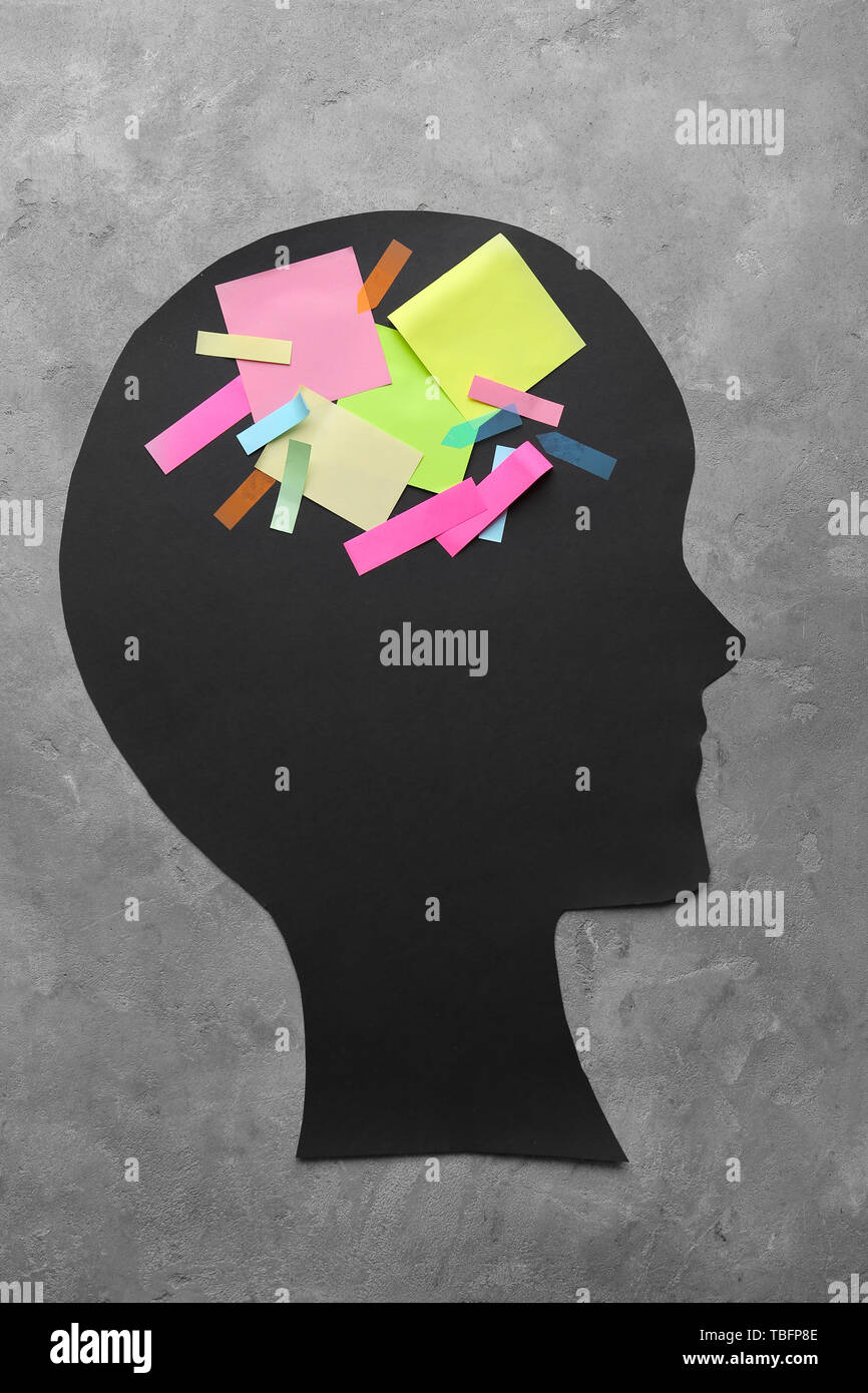 Human head with sticky papers on grey background Stock Photo - Alamy