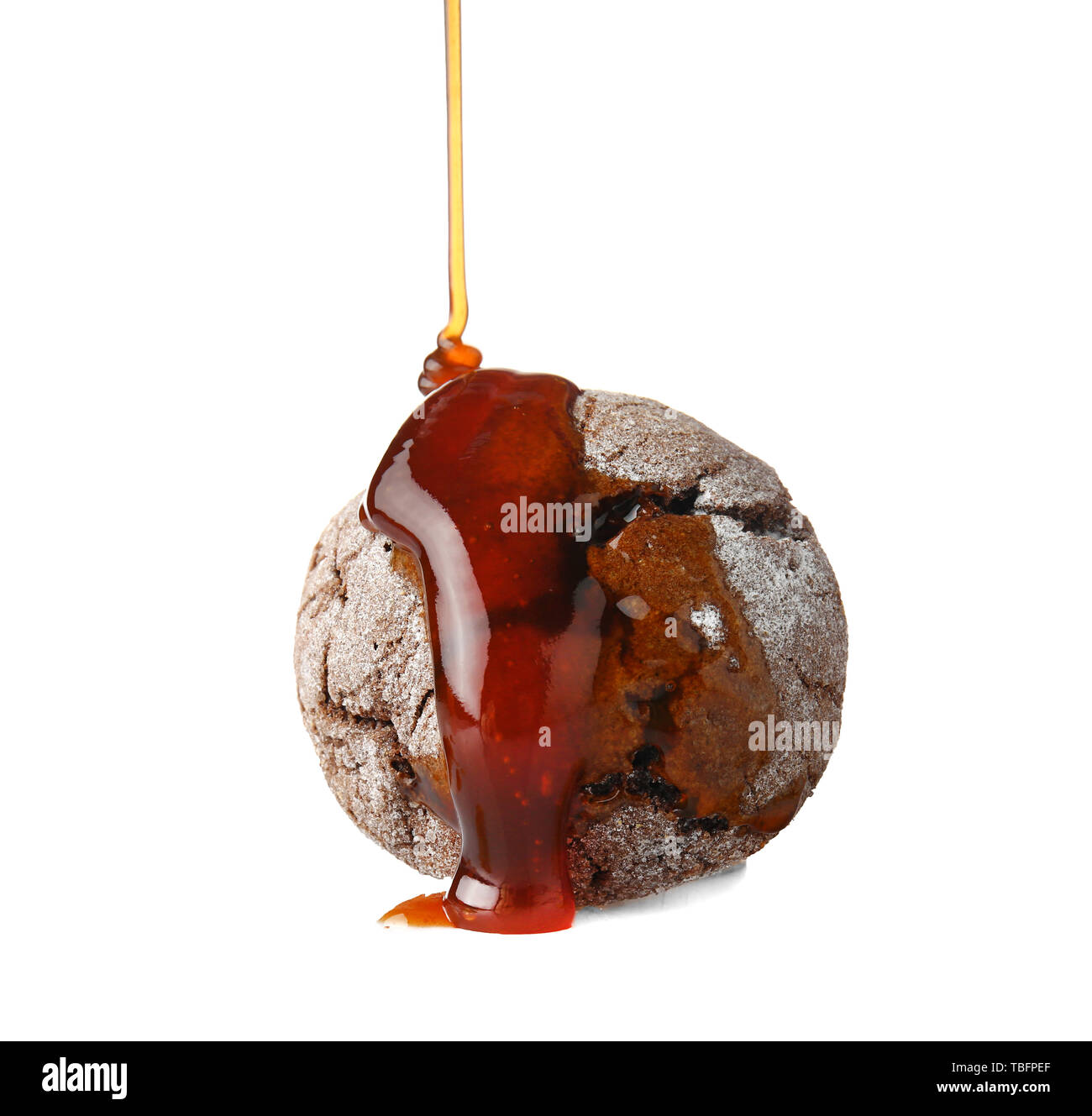 Liquid caramel pouring on muffin against white background Stock Photo ...
