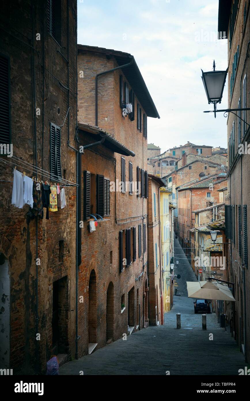 Street view with old buildings in Siena, Italy Stock Photo - Alamy