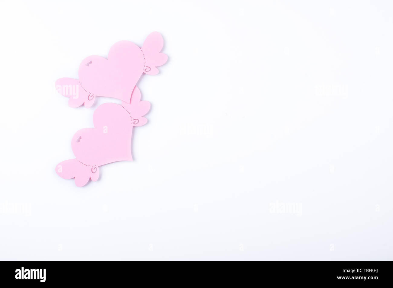Pink cherubs love heart shape on white background Stock Photo - Alamy
