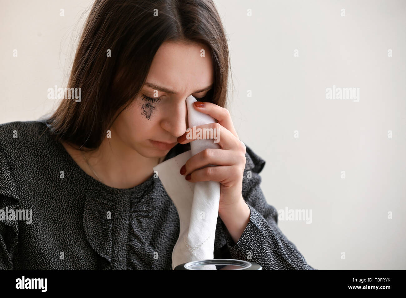 Crying woman at funeral Stock Photo - Alamy
