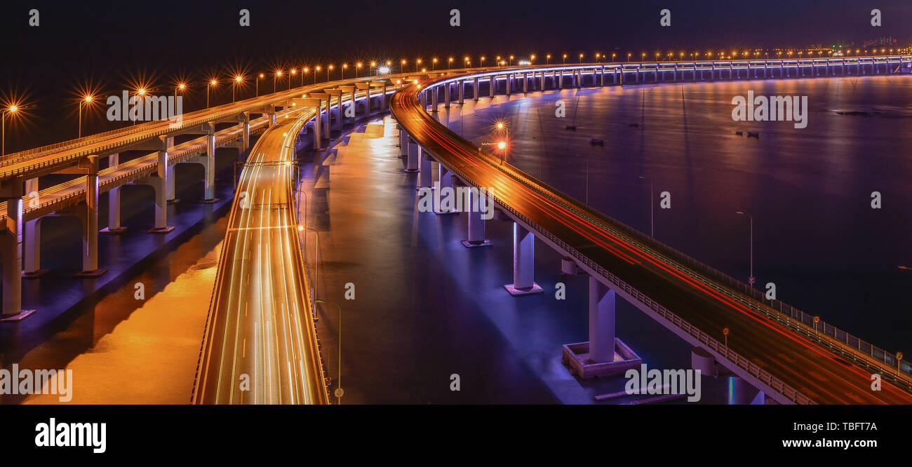High speed and cross sea bridge at night hi-res stock photography and ...