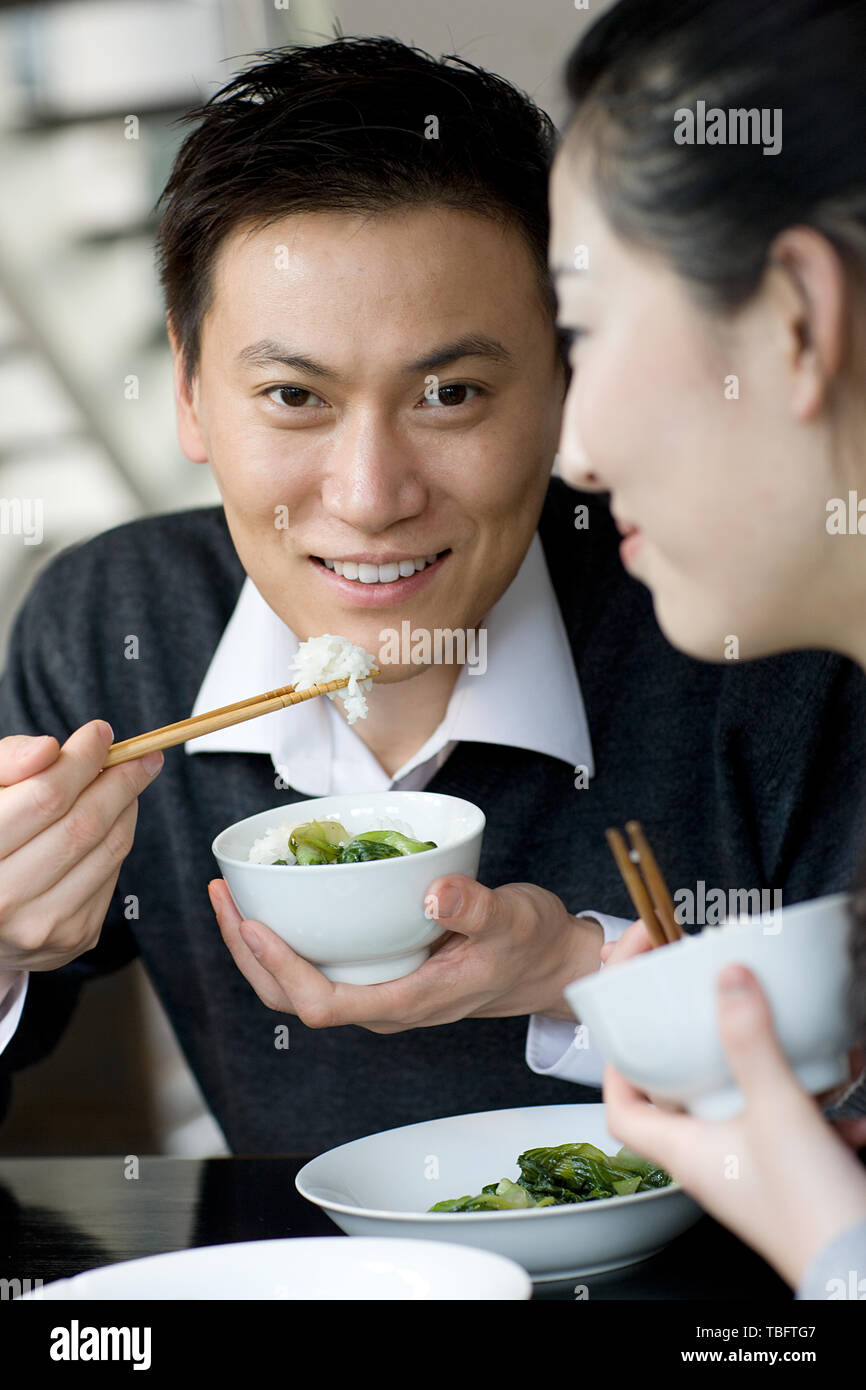 Smiling chinese couple facing hi-res stock photography and images - Alamy