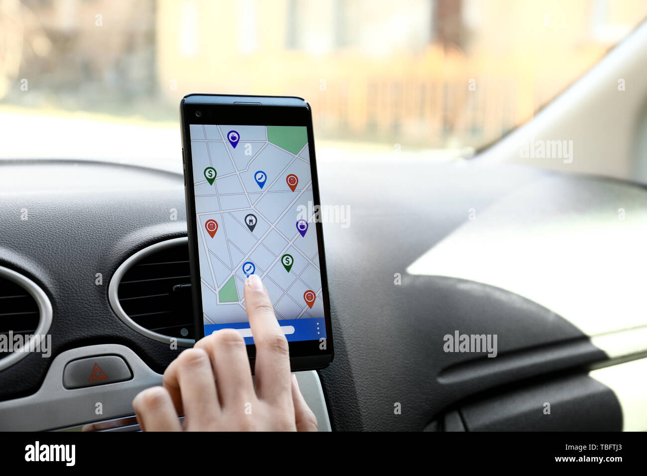 Car driver using mobile phone for navigation Stock Photo - Alamy