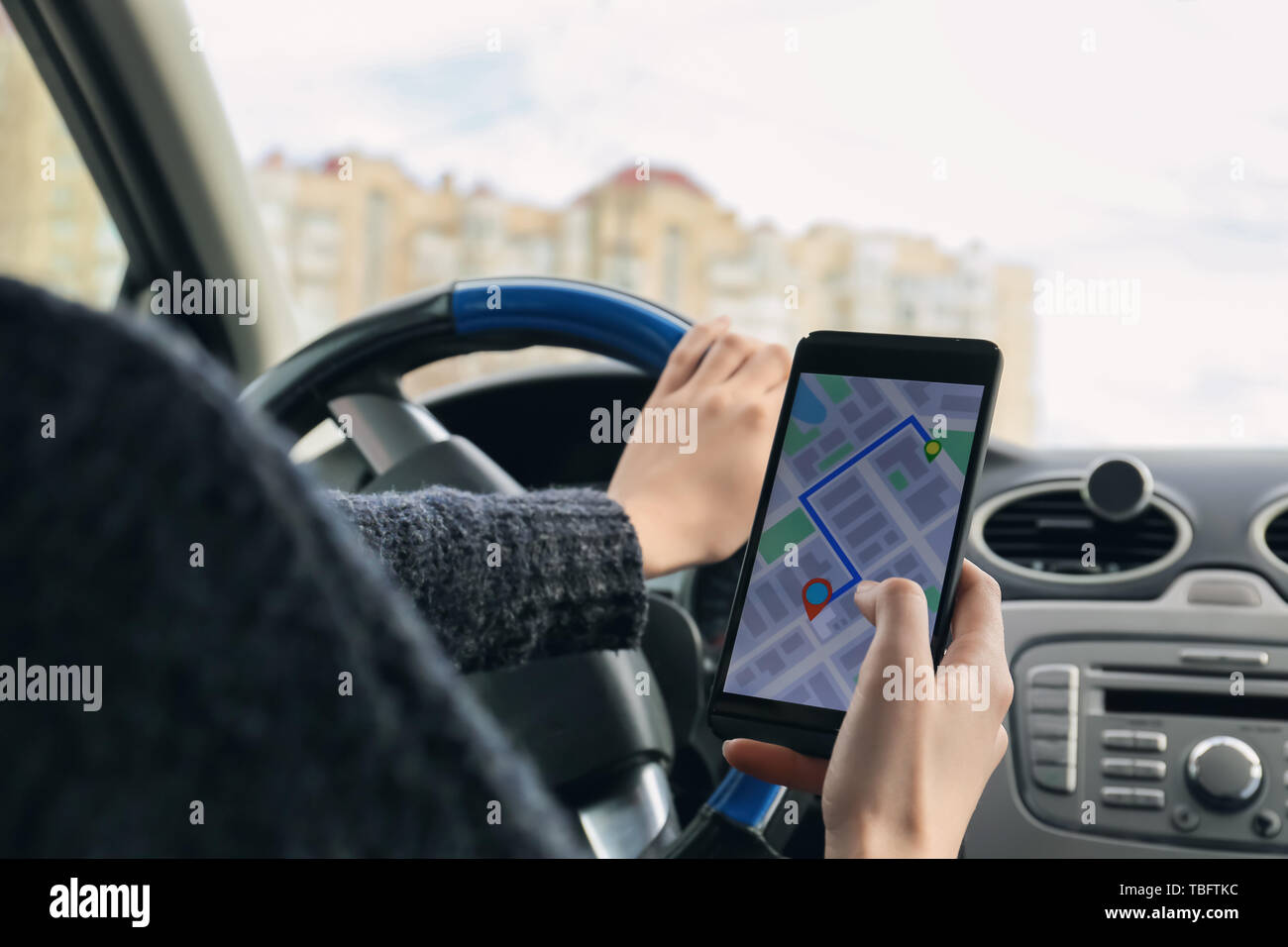 Car driver using mobile phone for navigation Stock Photo - Alamy
