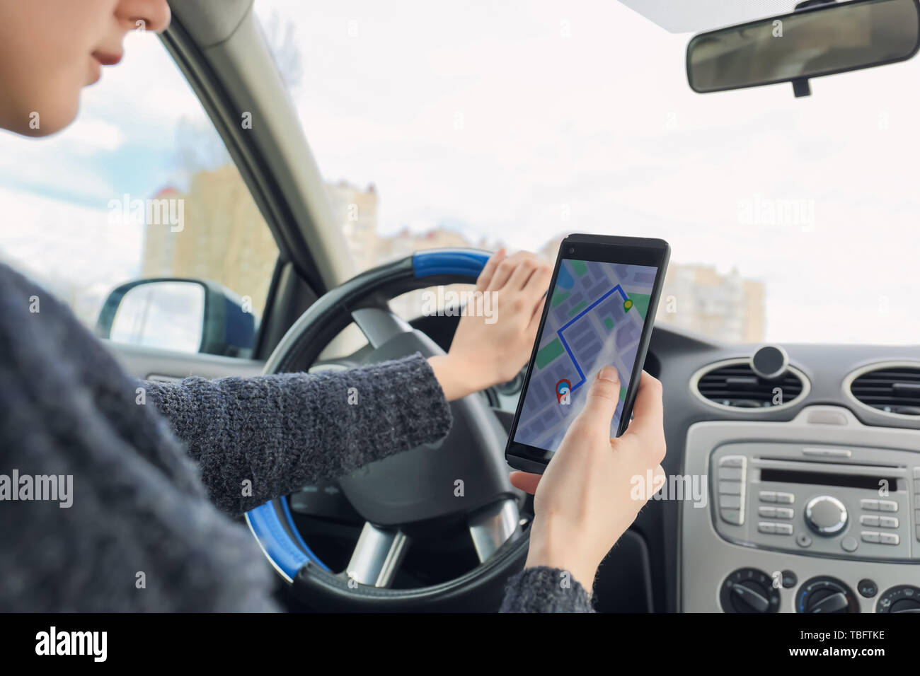 Car driver using mobile phone for navigation Stock Photo - Alamy