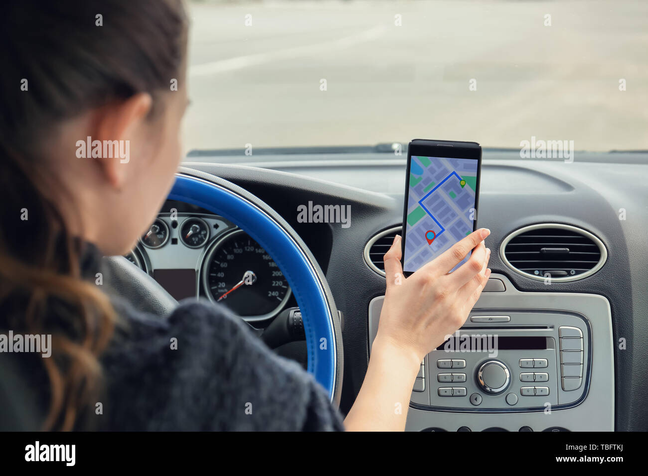 Car driver using mobile phone for navigation Stock Photo - Alamy