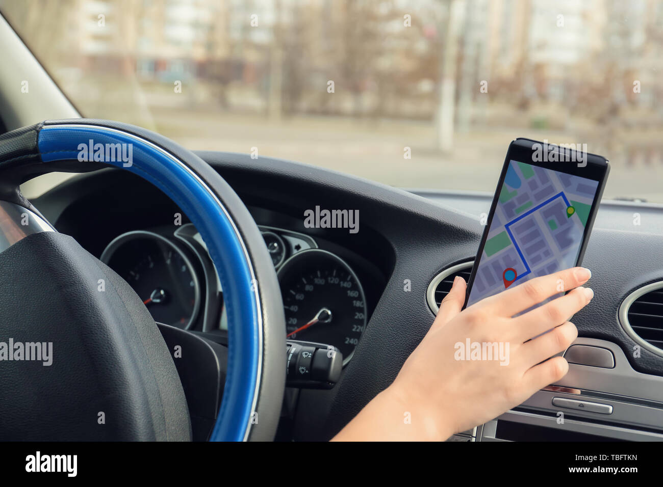 Car driver using mobile phone for navigation Stock Photo - Alamy