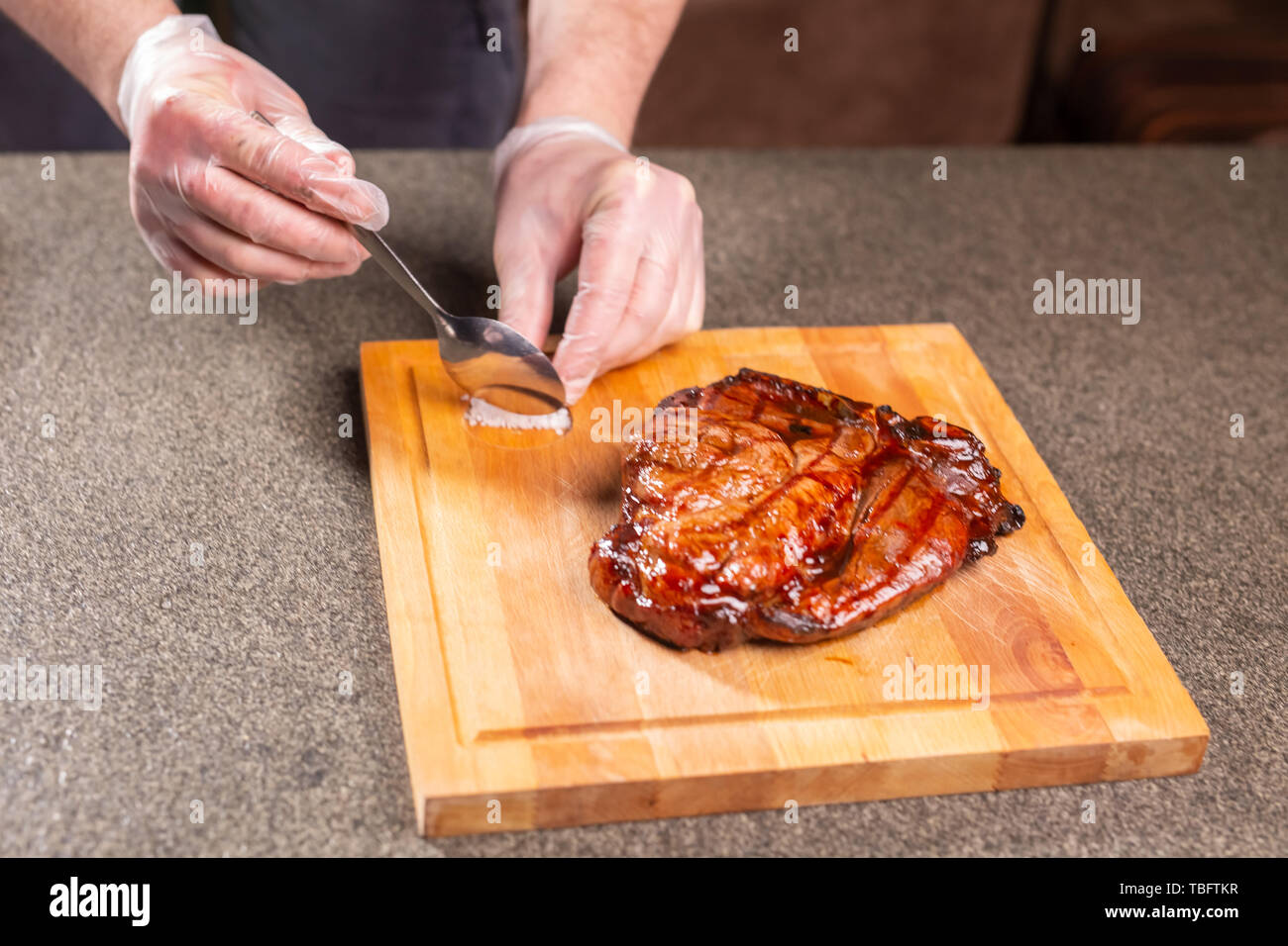 food, delicious and craft concept - Man cutting horse steak Stock Photo ...