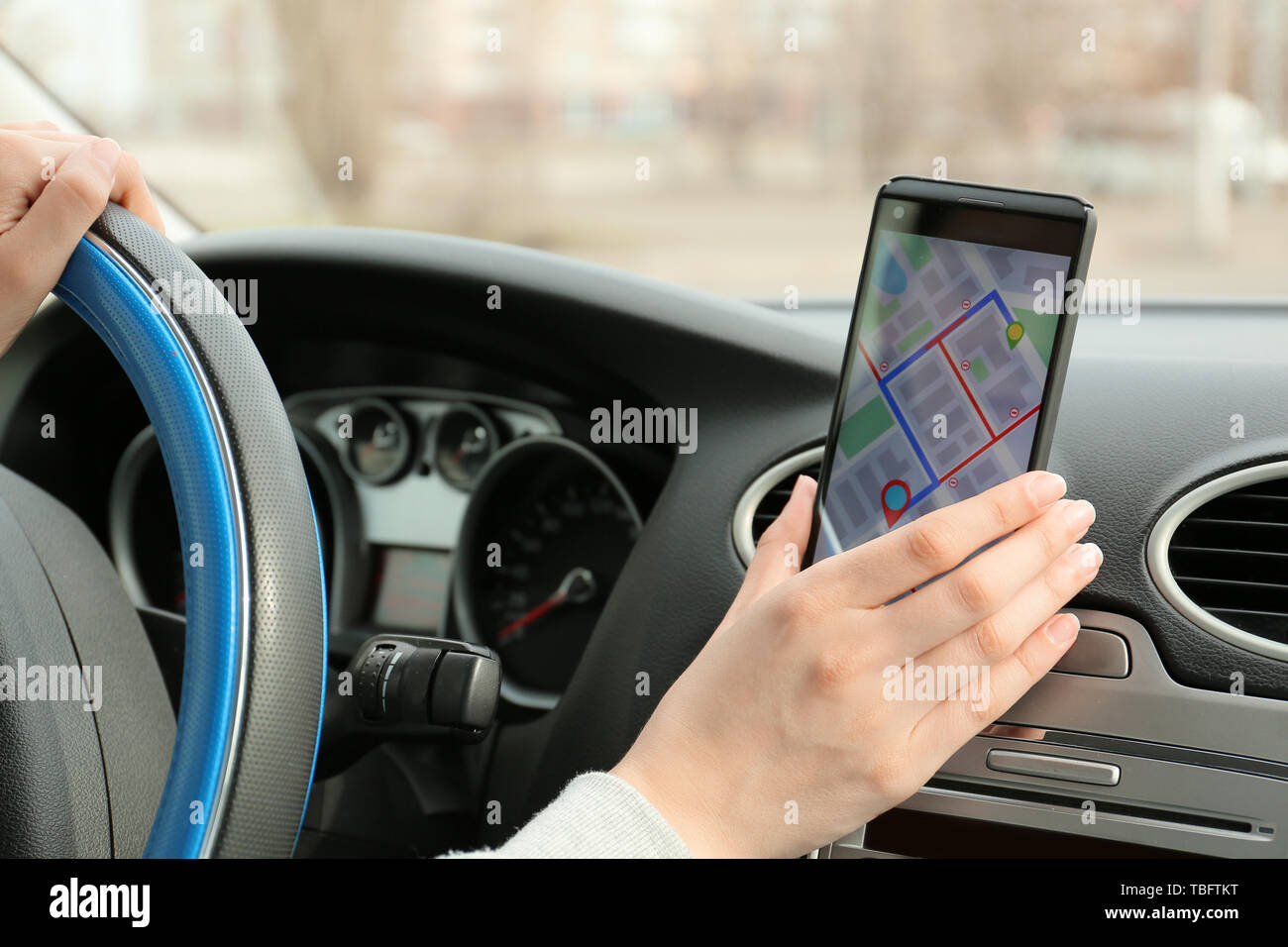 Car driver using mobile phone for navigation Stock Photo - Alamy