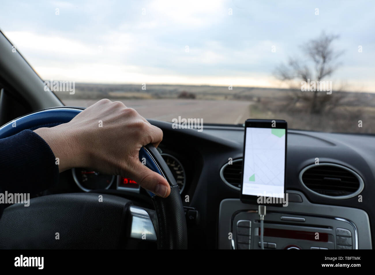 Car driver using mobile phone for navigation Stock Photo - Alamy