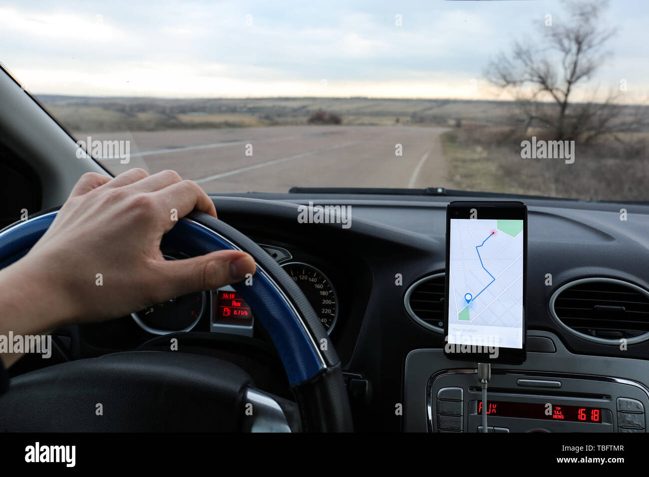 Car driver using mobile phone for navigation Stock Photo - Alamy