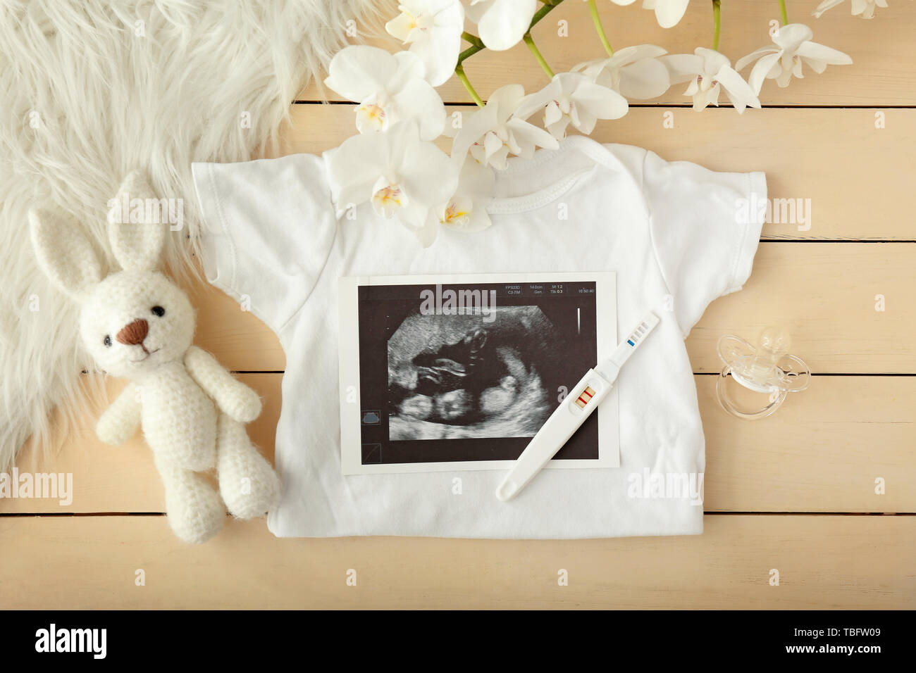 Pregnancy test baby clothes hi-res stock photography and images - Alamy