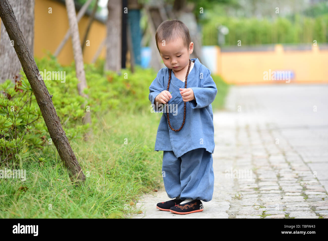 Cute little monk, children's photography Stock Photo - Alamy
