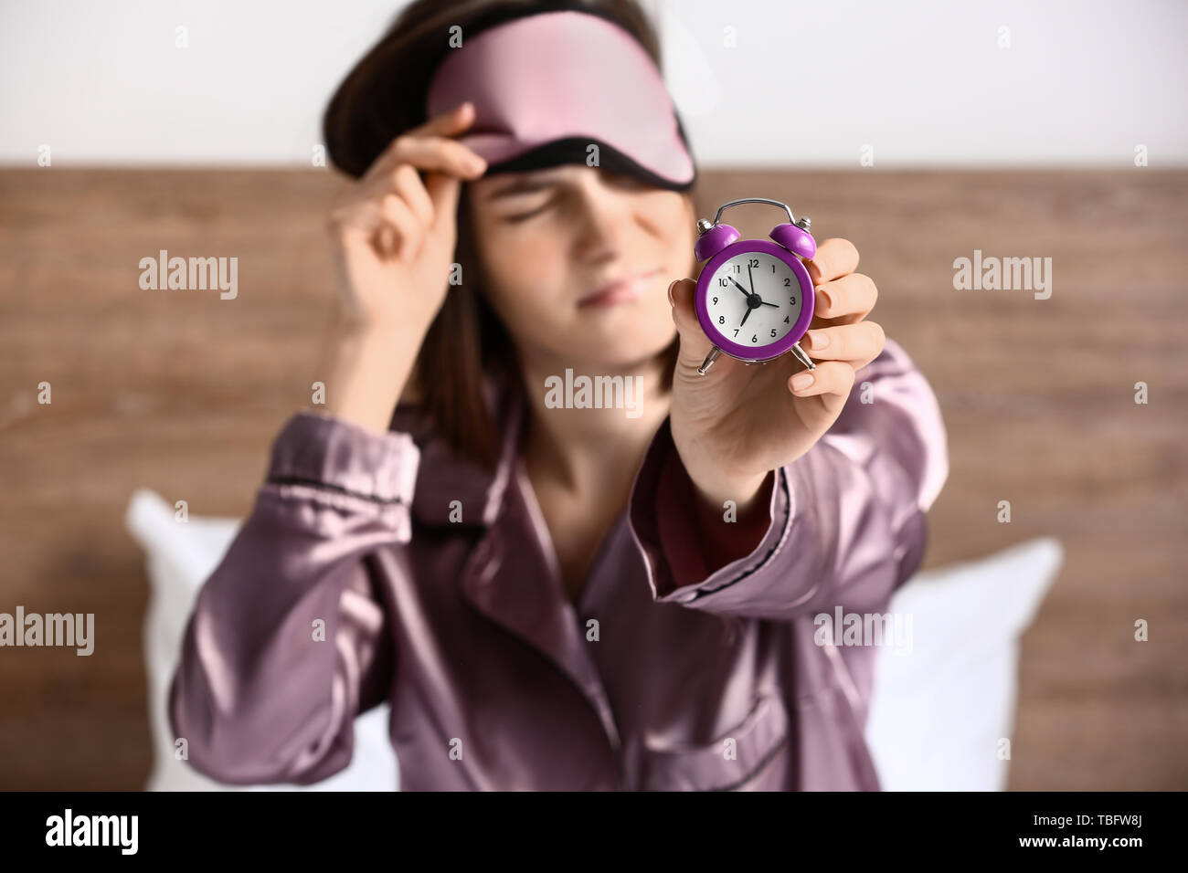 Woman in sleep mask alarm clock hi-res stock photography and images - Alamy