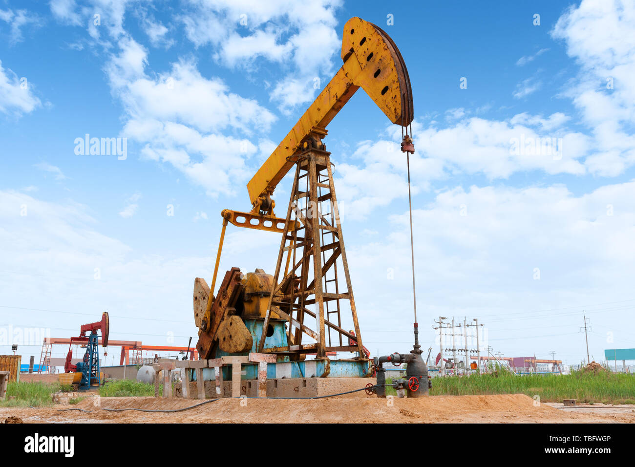 Oil well and bluesky Stock Photo - Alamy