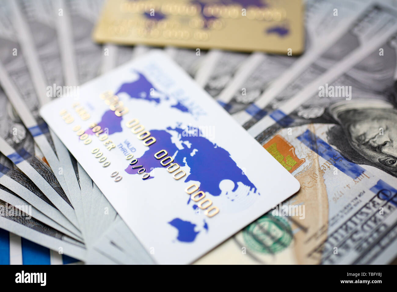 Huge pack of US money and bank card lying down on important financial ...
