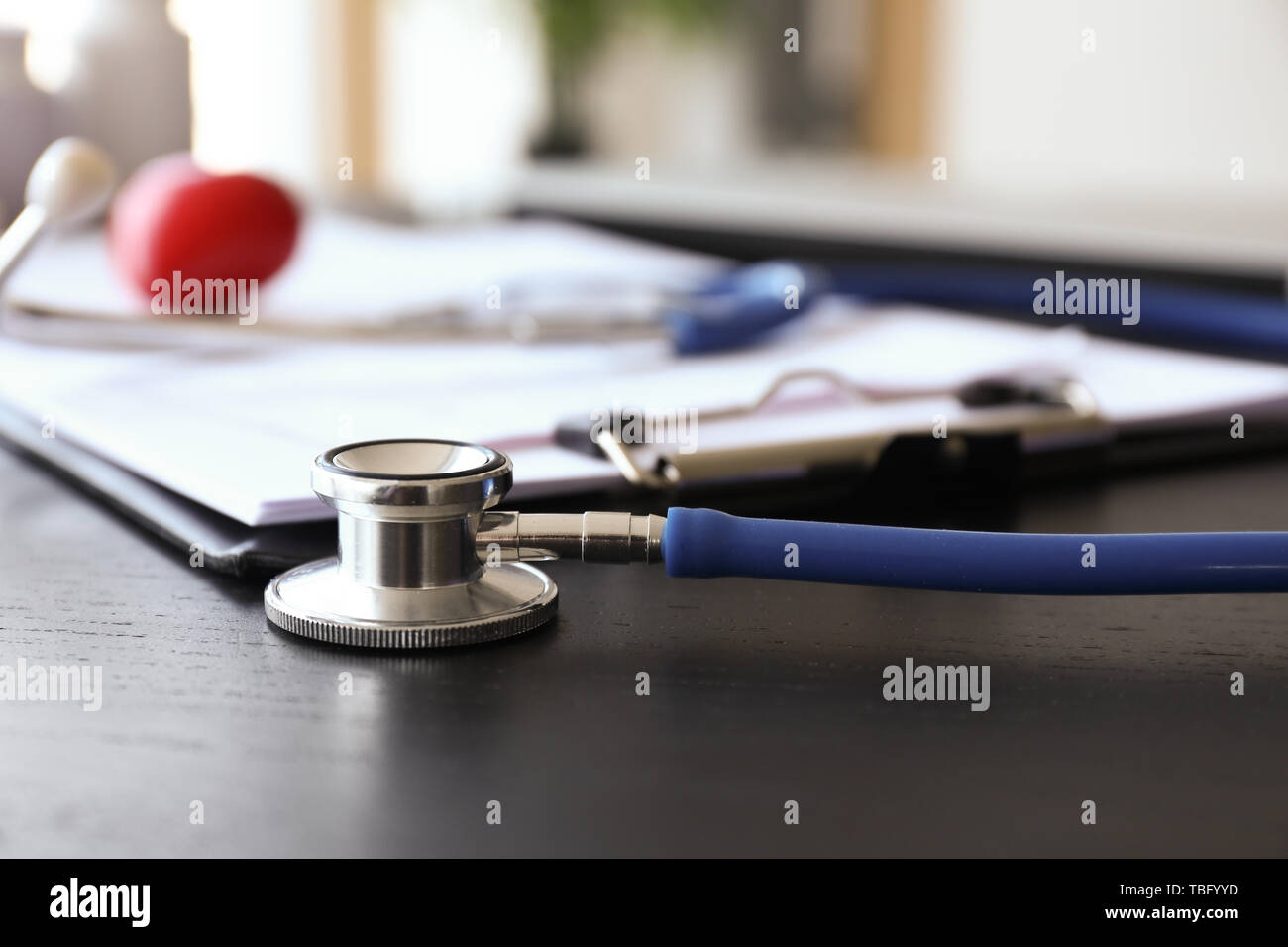 Stethoscope on table in clinic Stock Photo - Alamy