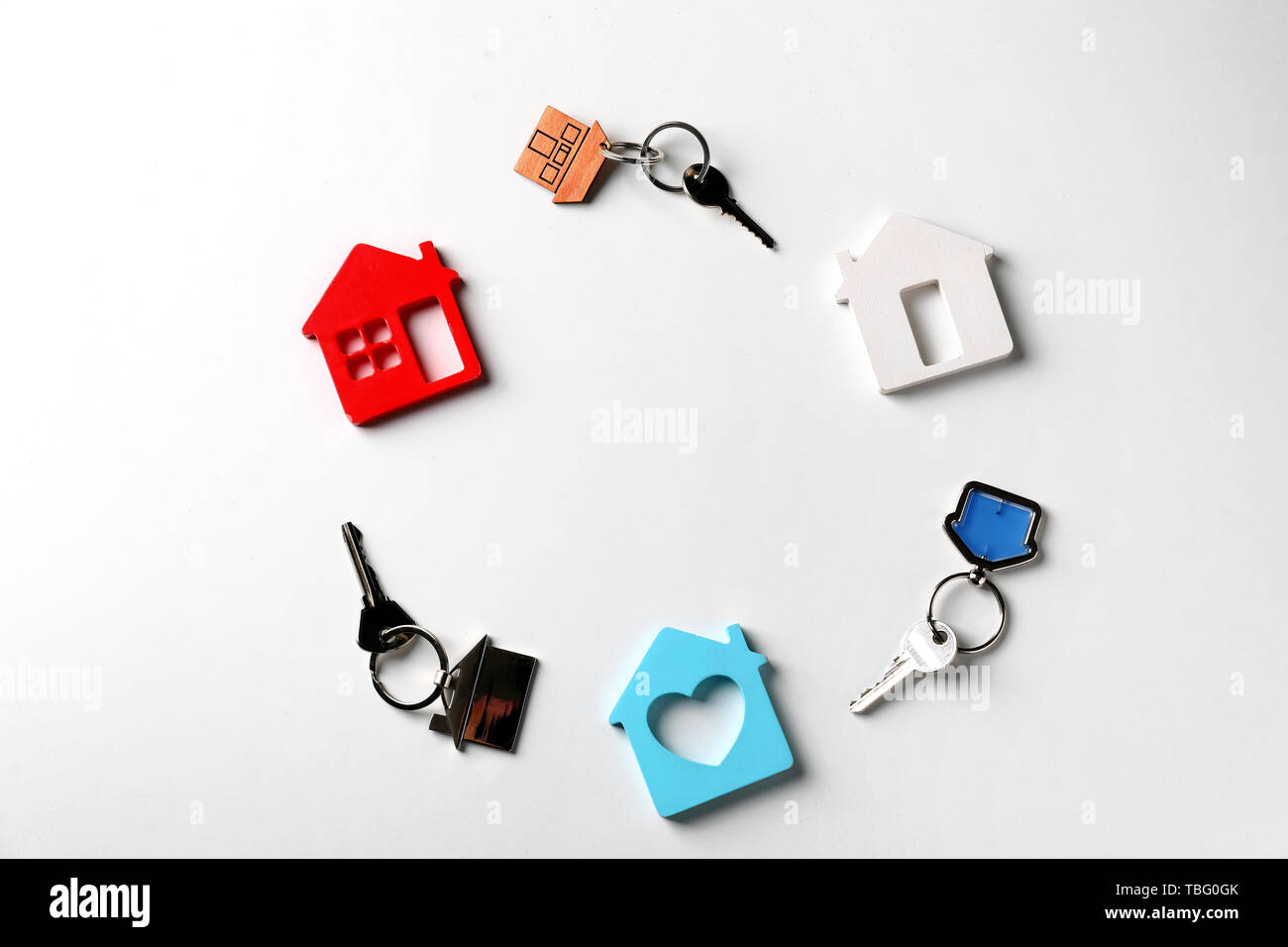 Models of house with keys on white background. Concept of earthquake ...
