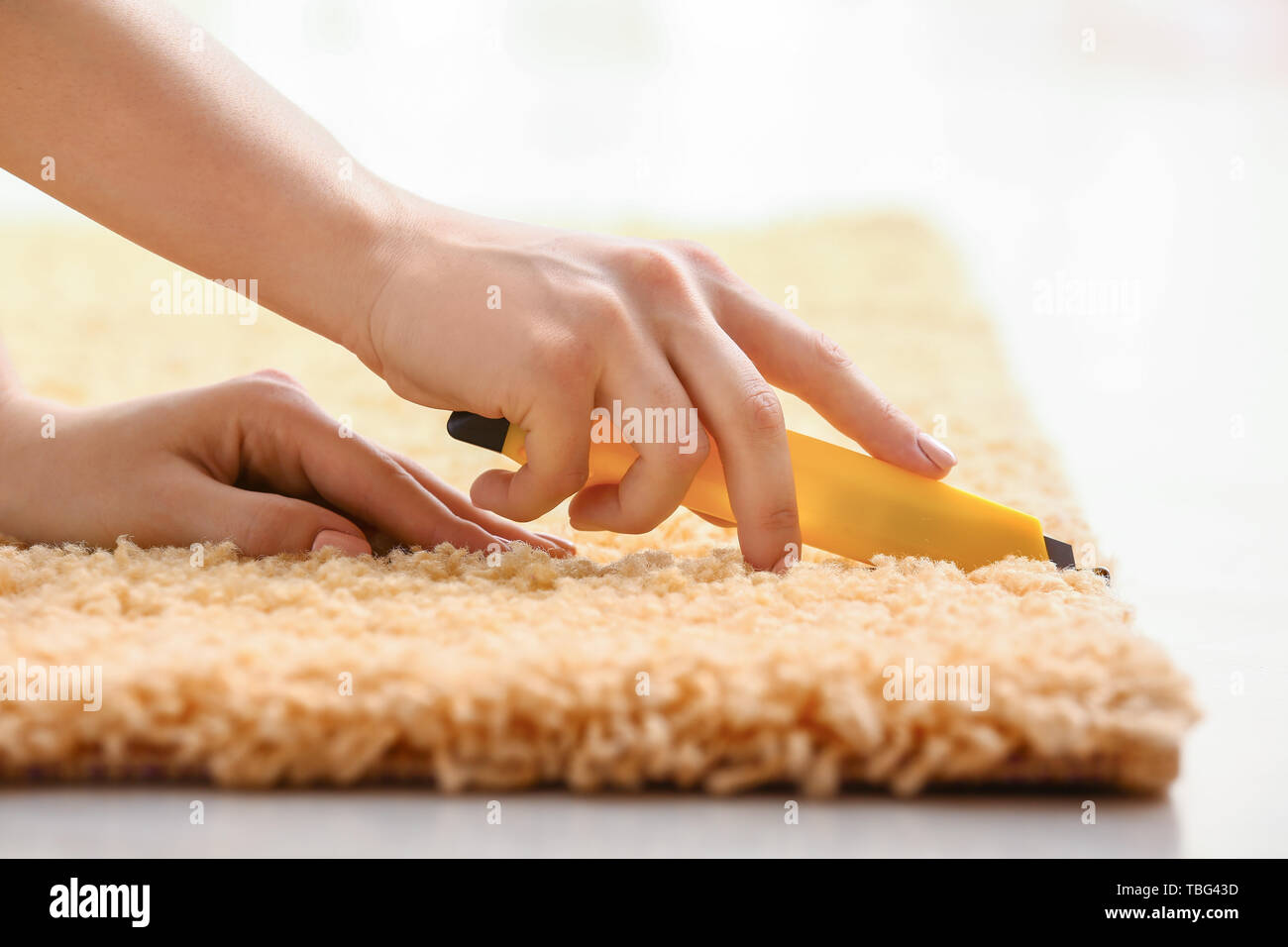 Rug cutter hi-res stock photography and images - Alamy